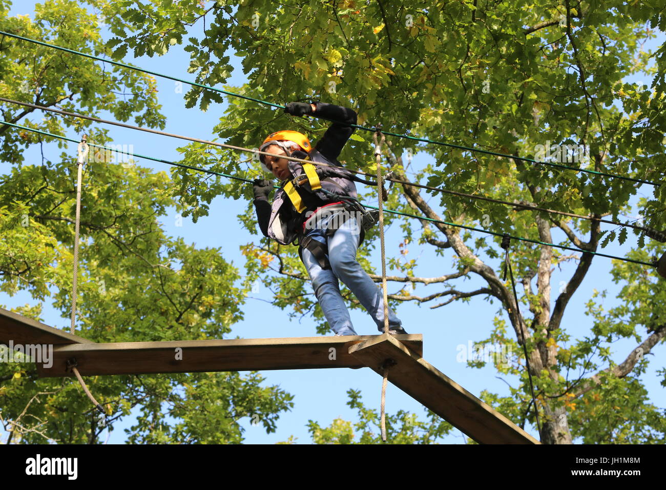 10-year-old boy on a rope course. France Stock Photo - Alamy