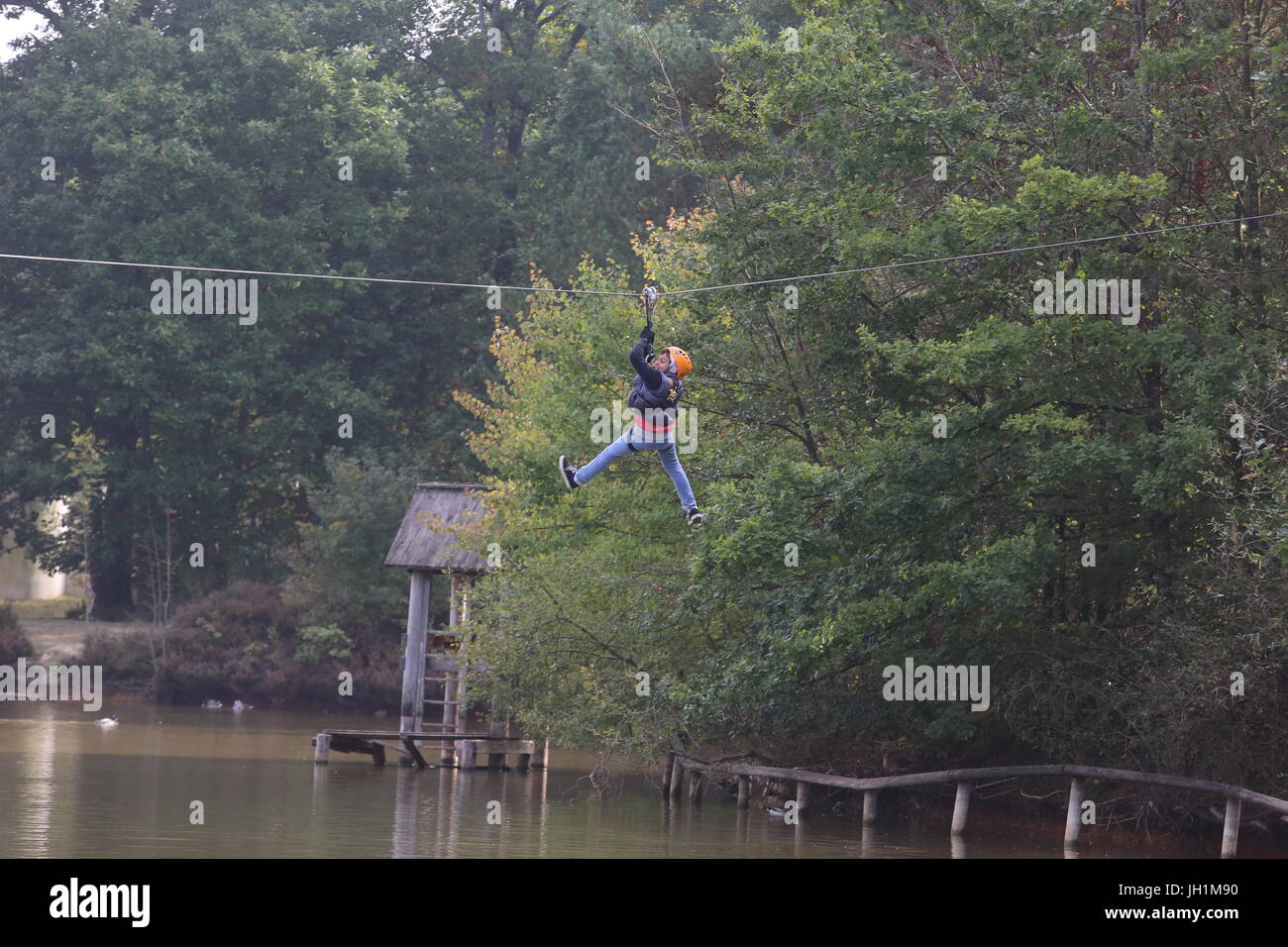 10-year-old boy on a rope course. France Stock Photo - Alamy