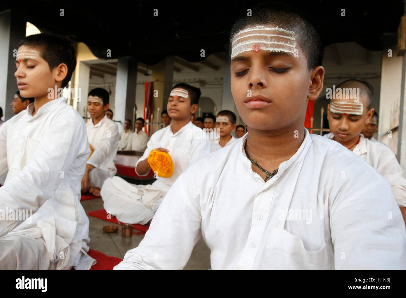 Brahmachari students practising meditation in a Vrindavan temple, Uttar ...
