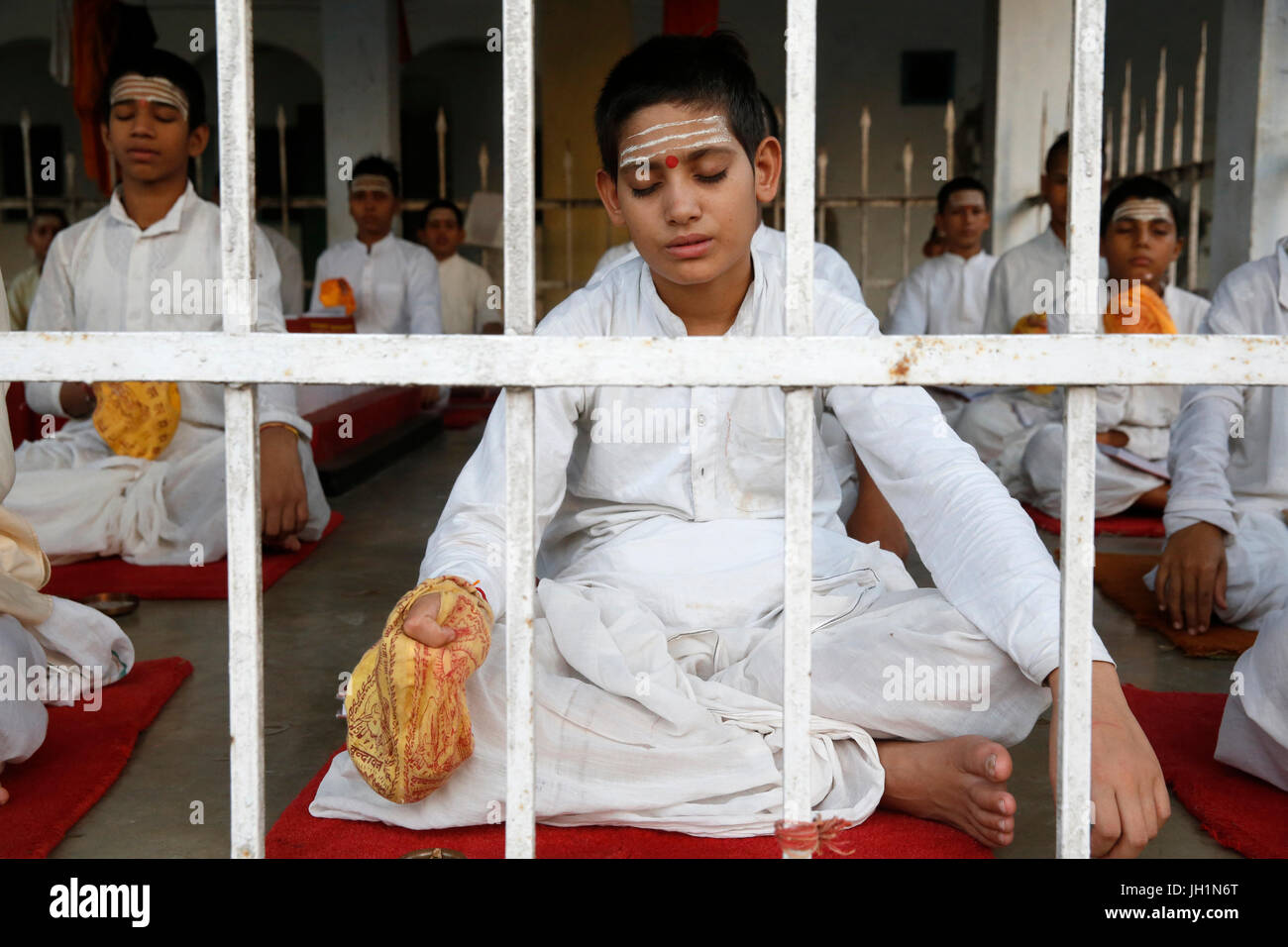 Brahmachari students practising meditation in a Vrindavan temple, Uttar ...