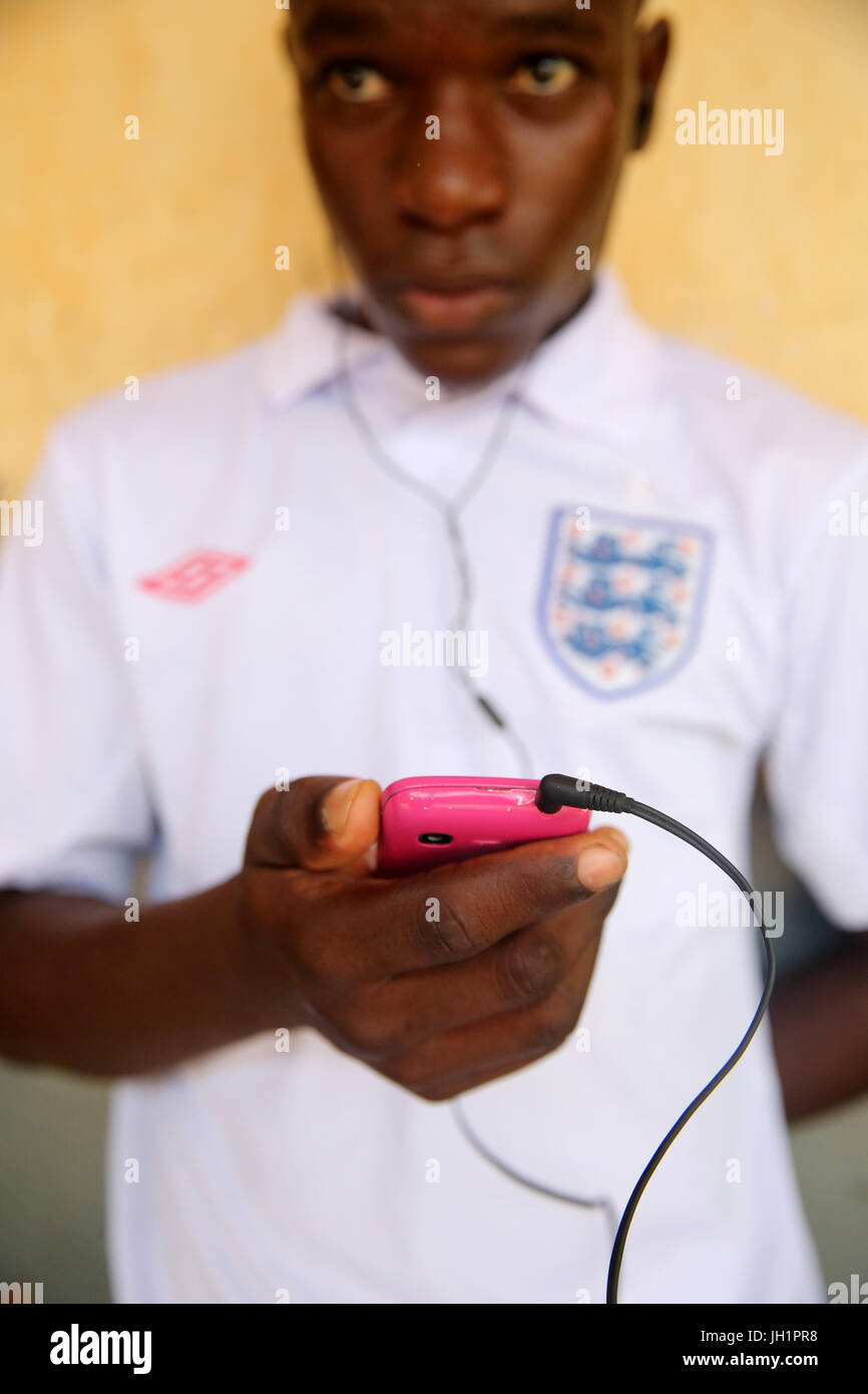 African boy using a smart phone. Lome. Togo Stock Photo - Alamy