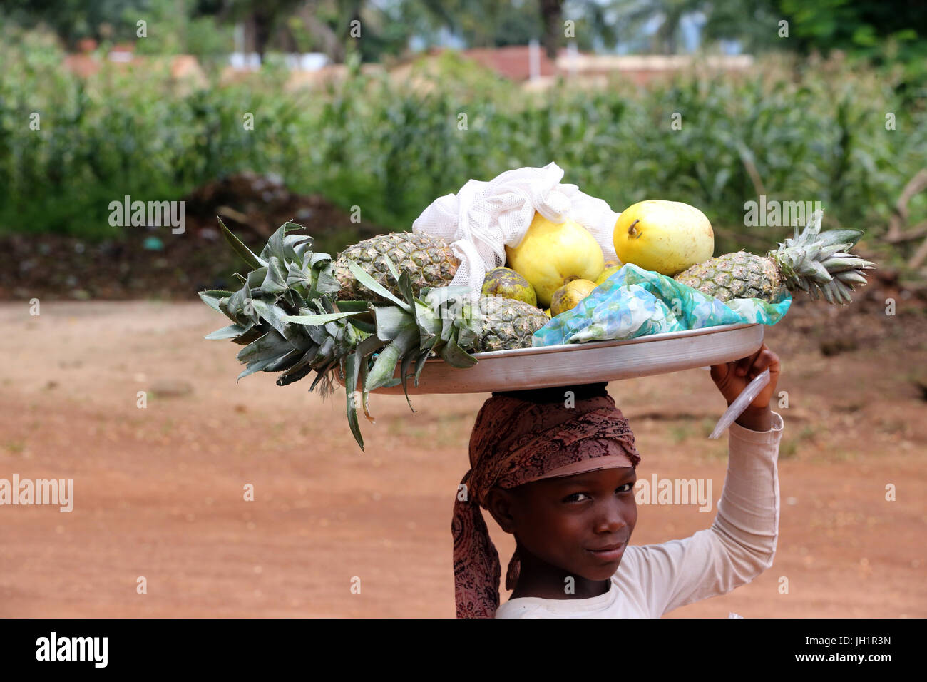Market child selling fruits hi-res stock photography and images - Alamy
