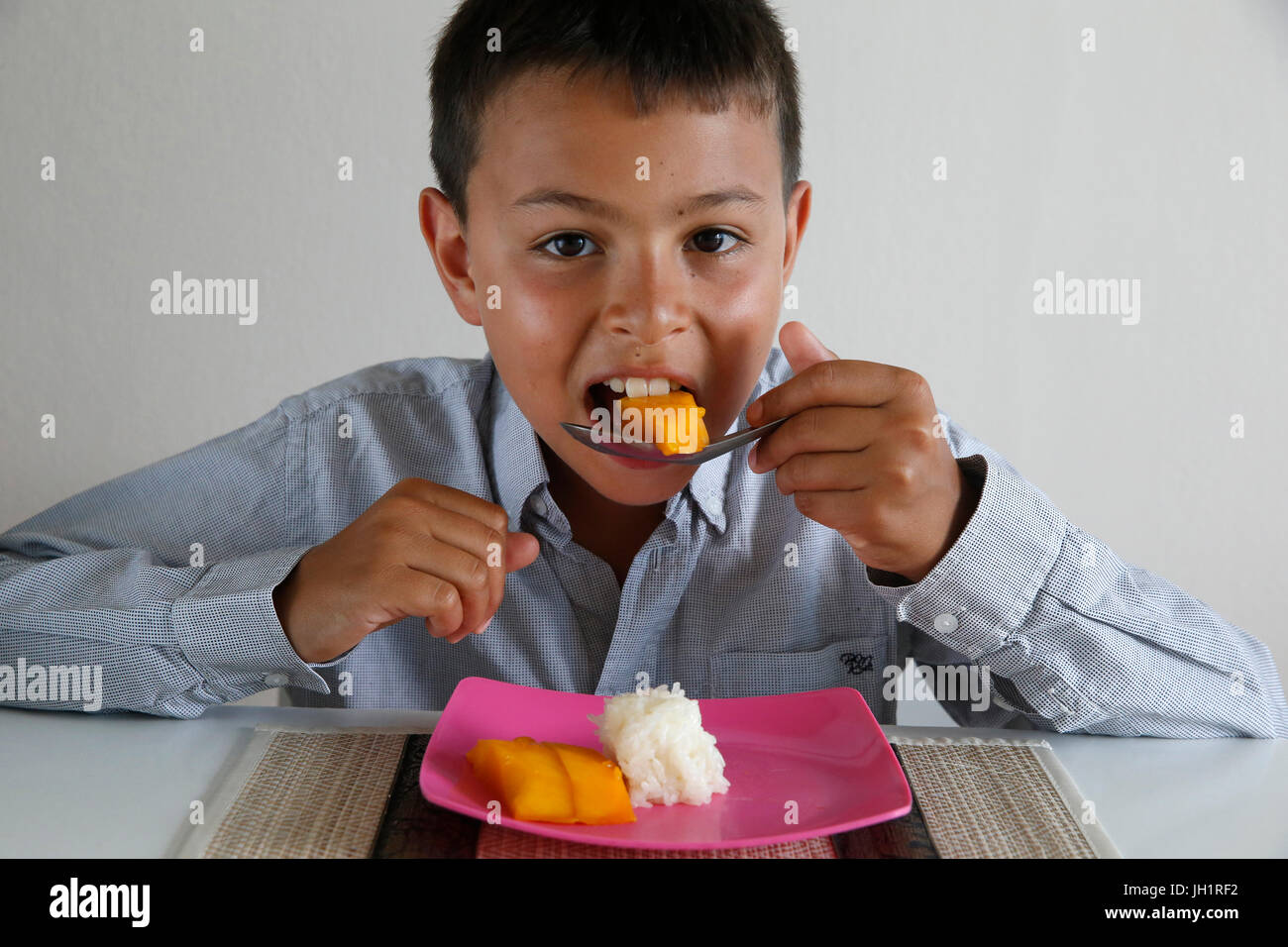 Asia child eating rice hi-res stock photography and images - Alamy