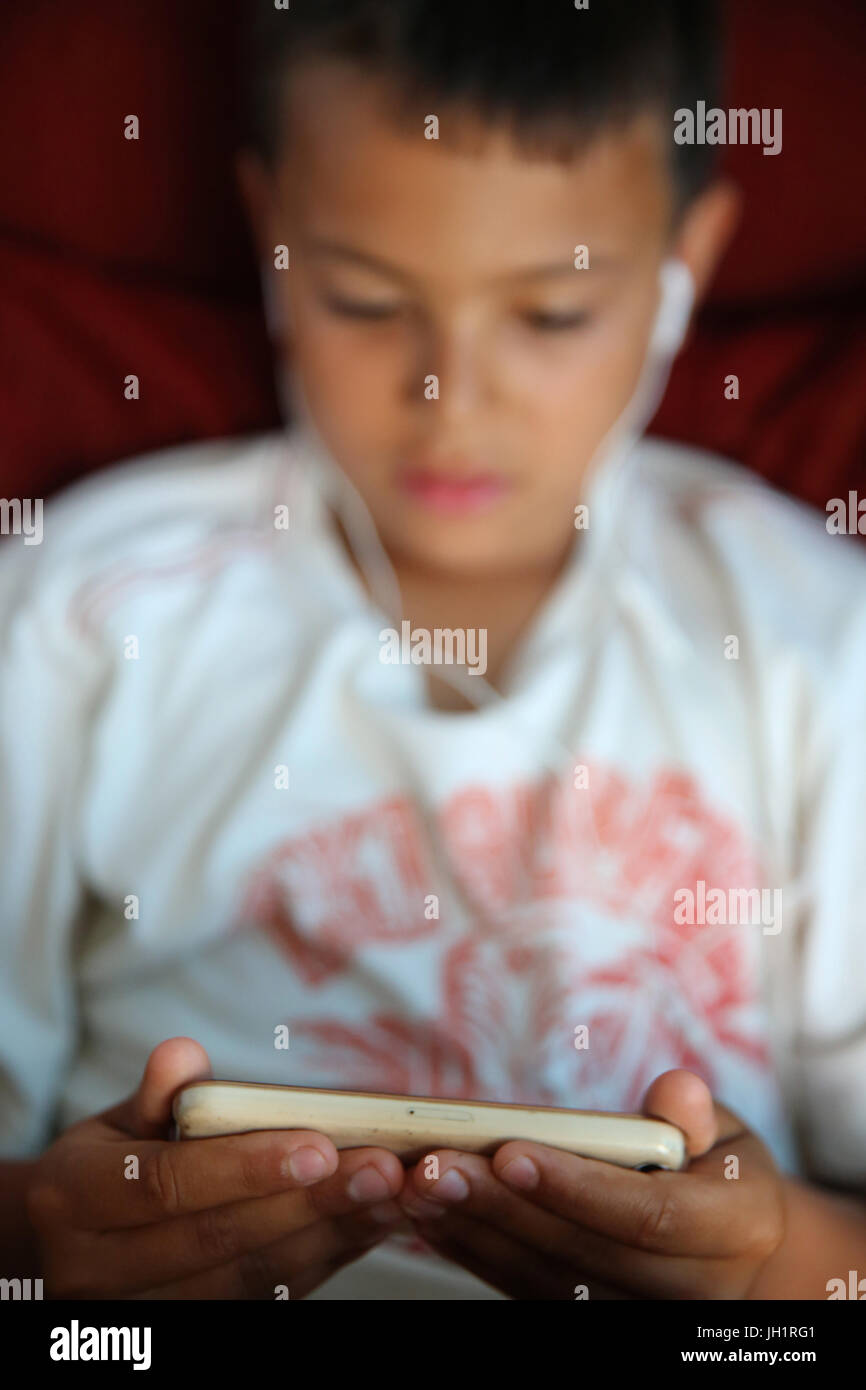 Boy using a cell phone. Thailand Stock Photo - Alamy