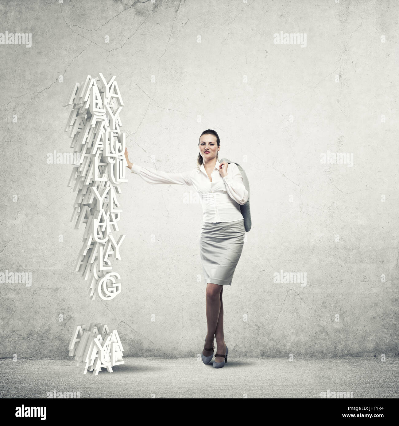 Woman and big attention sign Stock Photo - Alamy