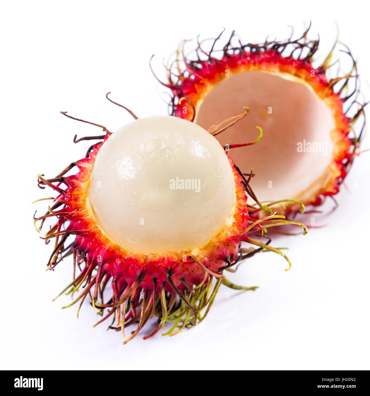 close up of an open rambutan isolated on a white background Stock Photo ...