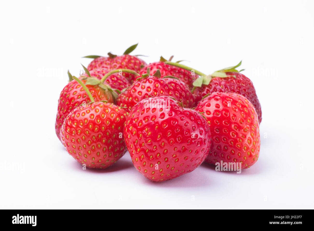 Strawberries. Group of strawberries on white studio shoot Stock Photo ...