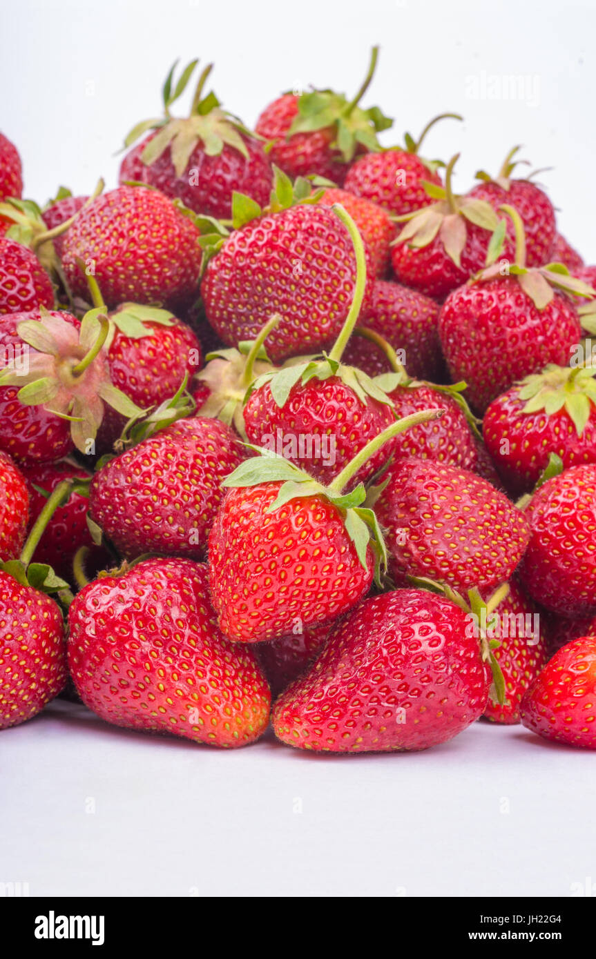 Strawberries. Group of strawberries on white studio shoot Stock Photo ...