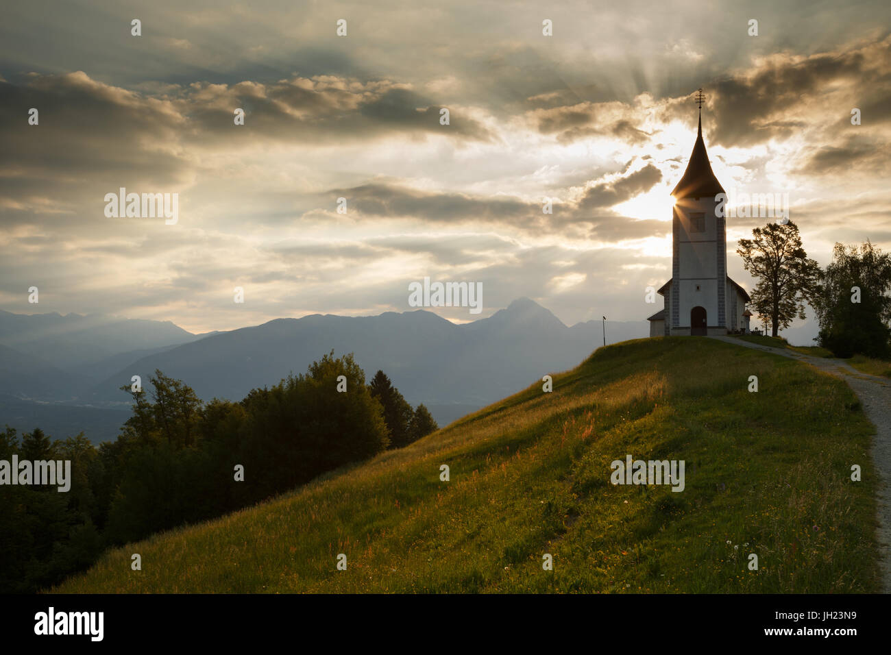 Jamnik church of Saints Primus and Felician at sunrise, perched on a ...