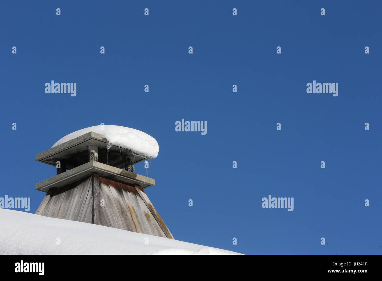 Chalet. Snow-capped chimney. France Stock Photo - Alamy