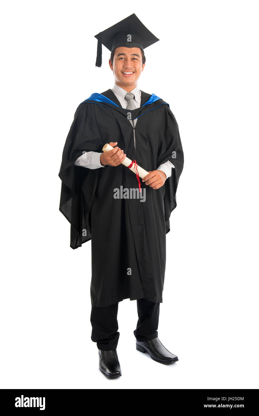 Full body happy Asian male university student in graduation gown ...