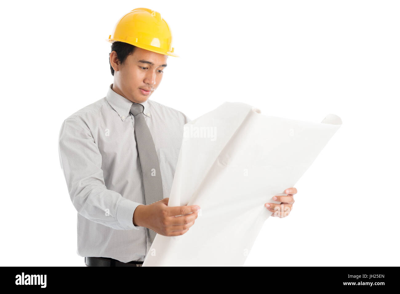 Portrait of attractive Southeast Asian engineer with yellow hard hat ...