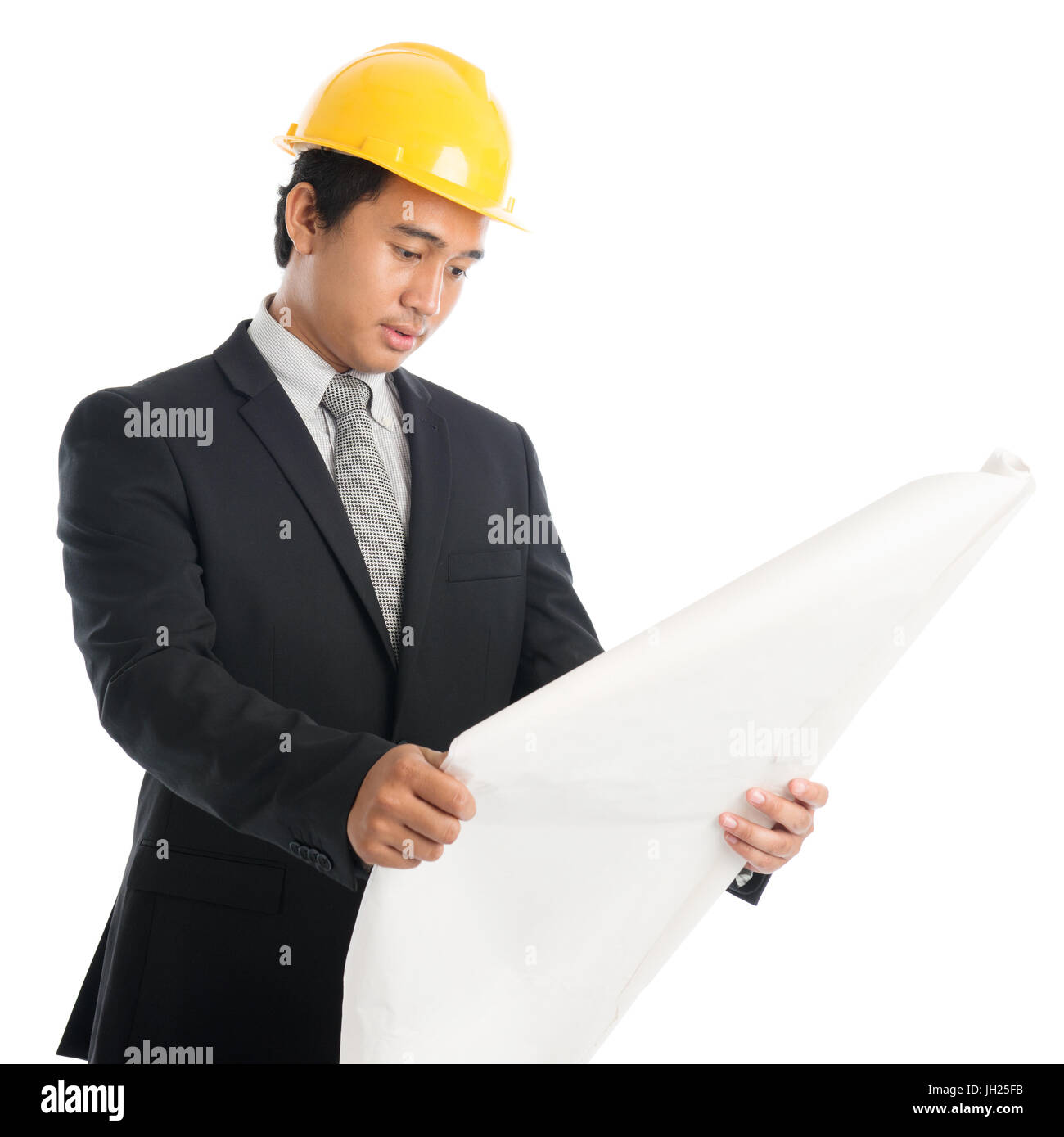 Portrait of attractive Southeast Asian engineer with yellow hard hat ...