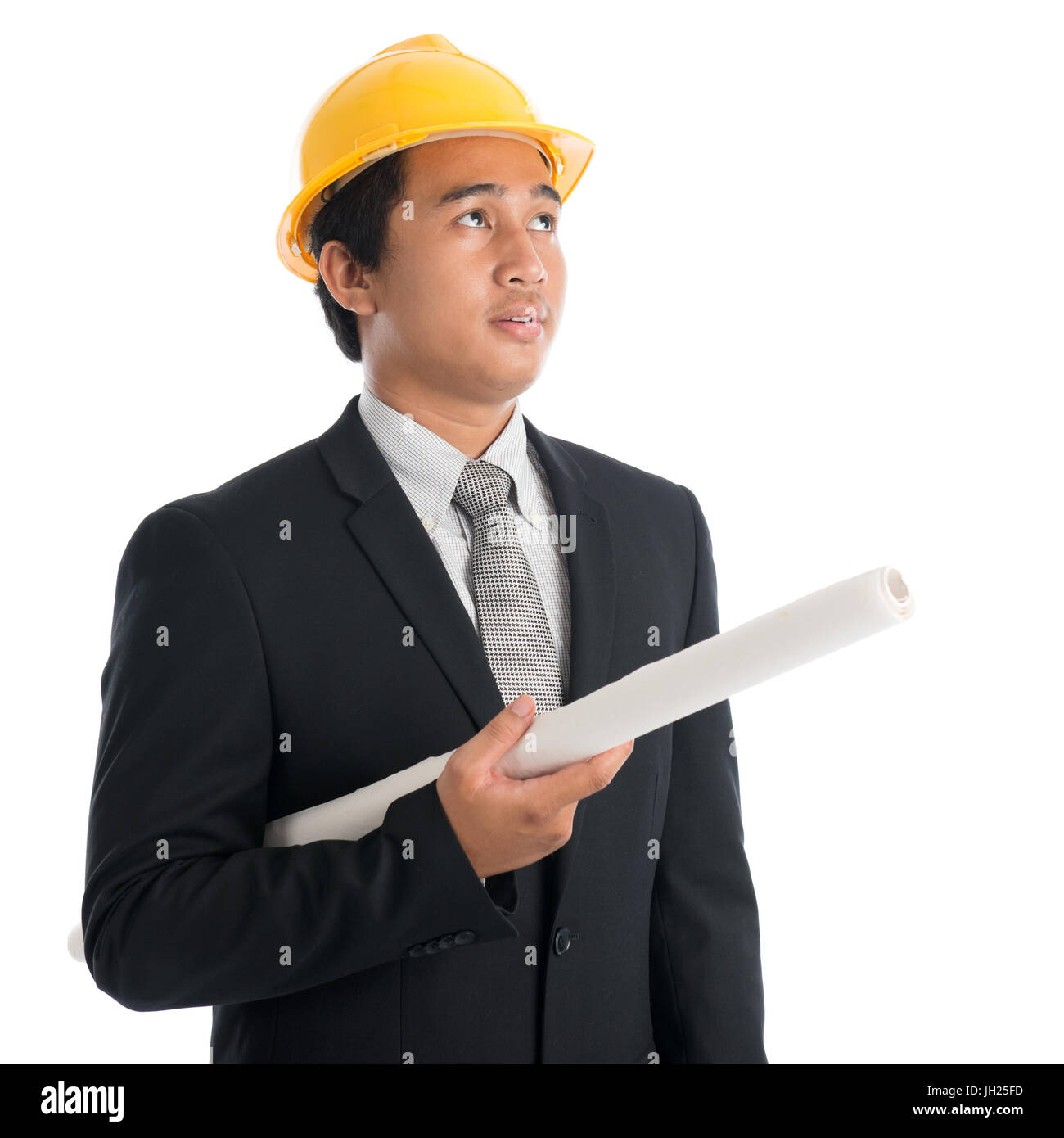 Portrait of attractive Southeast Asian engineer with yellow hard hat ...