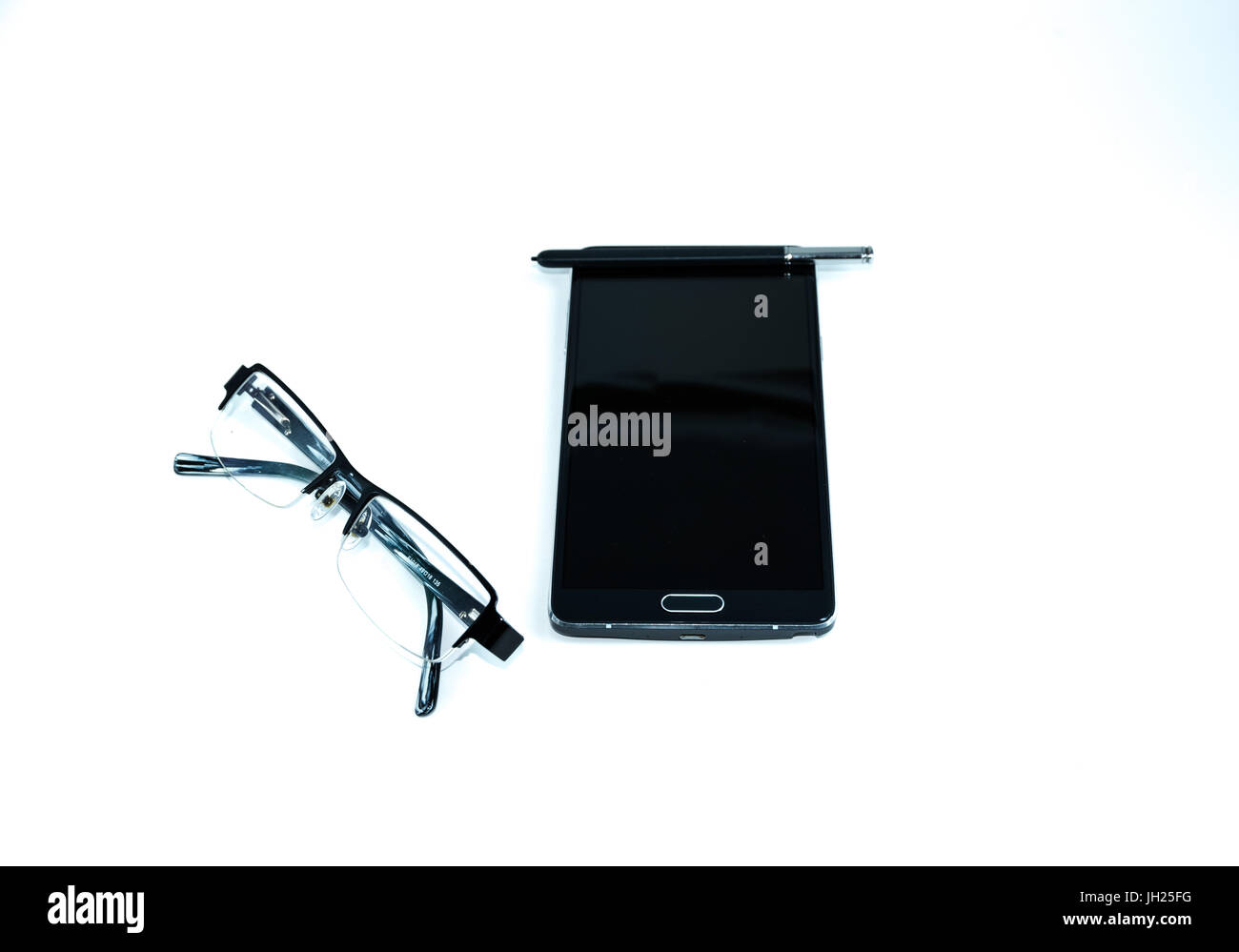Big black smart phone with smart pen and black eye glasses isolated on ...