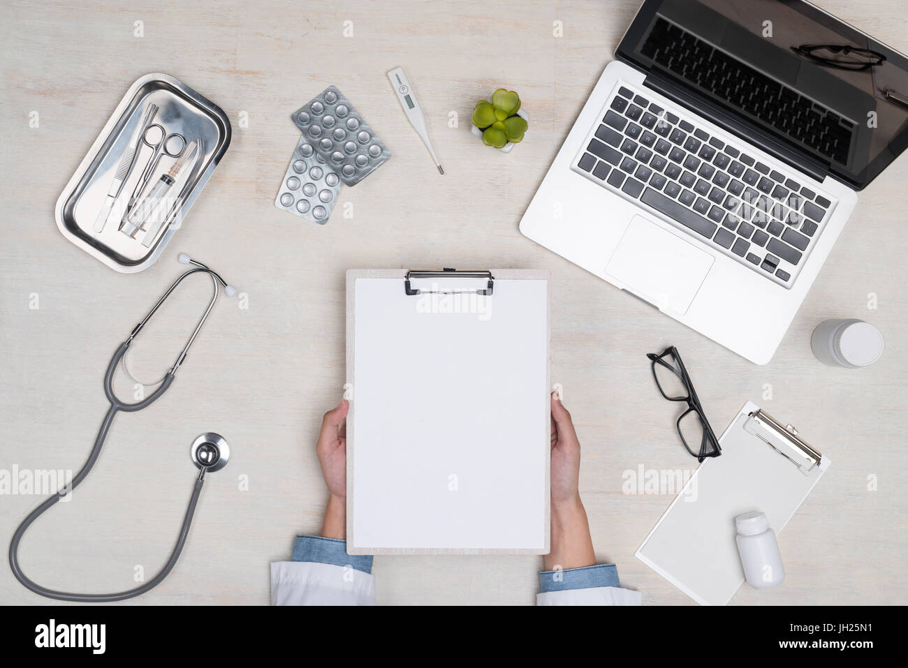 Top view of Medicine doctor hand working on the desk Stock Photo - Alamy