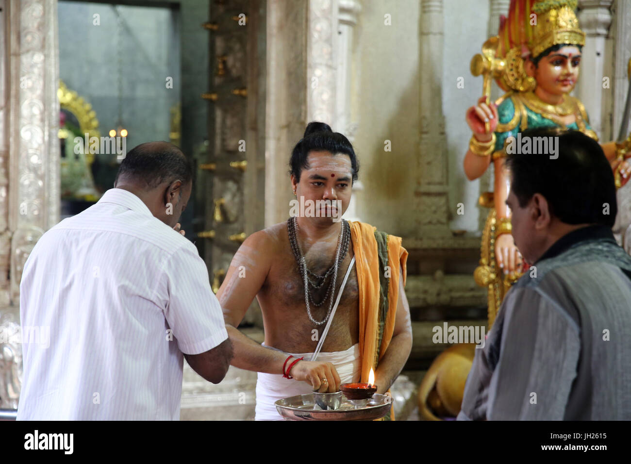 Sri Veeramakaliamman Hindu Temple. Hindu Brahmin priest. Hindu devotees ...