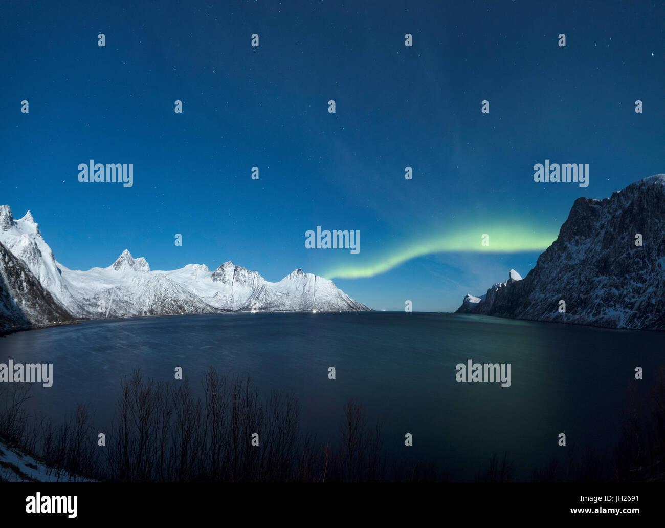 Panorama of the Northern Lights on the Senjahopen peak surrounded by ...