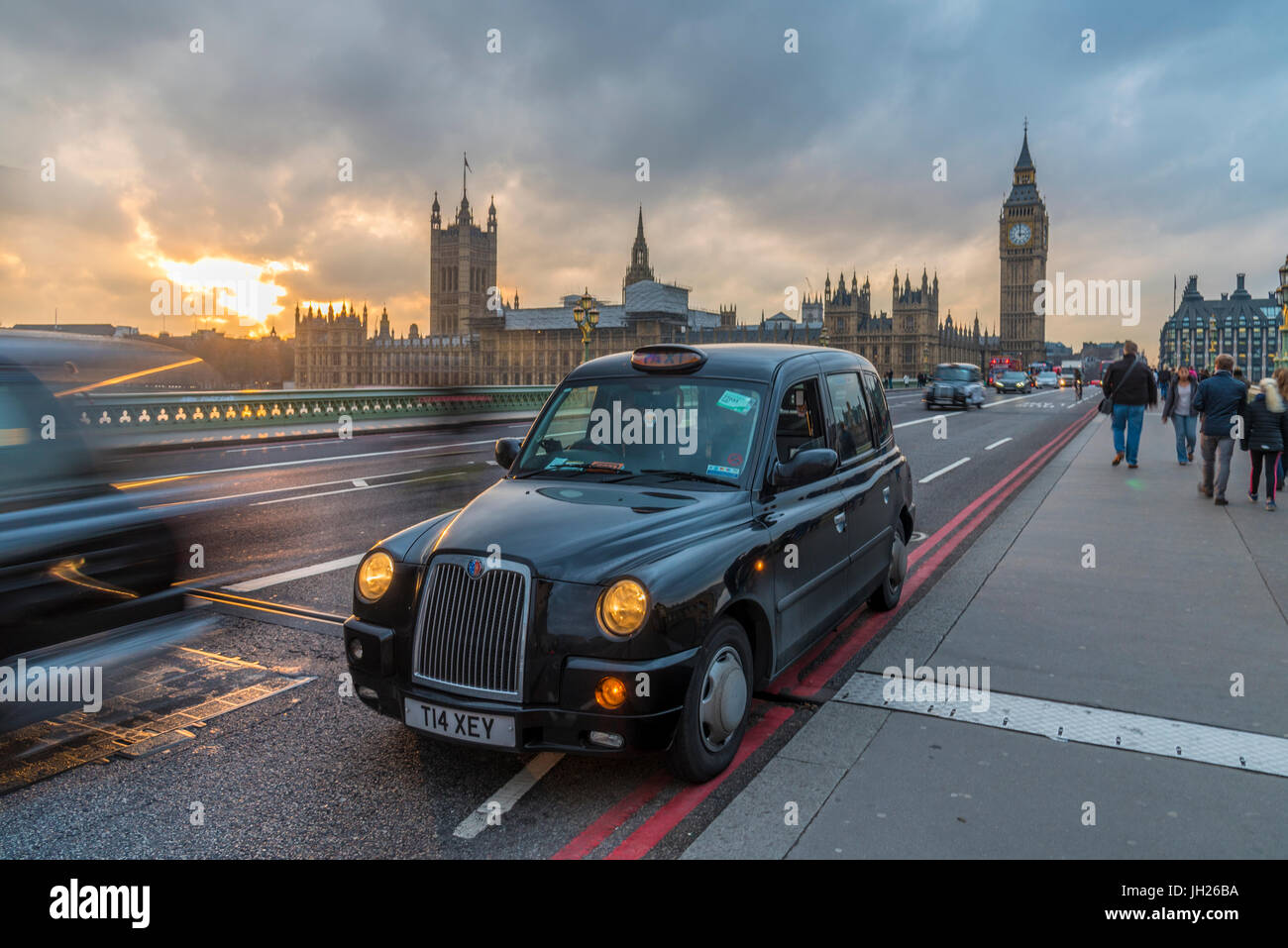 Sunset over a taxi and Big Ben on Westminster Bridge, London, England ...