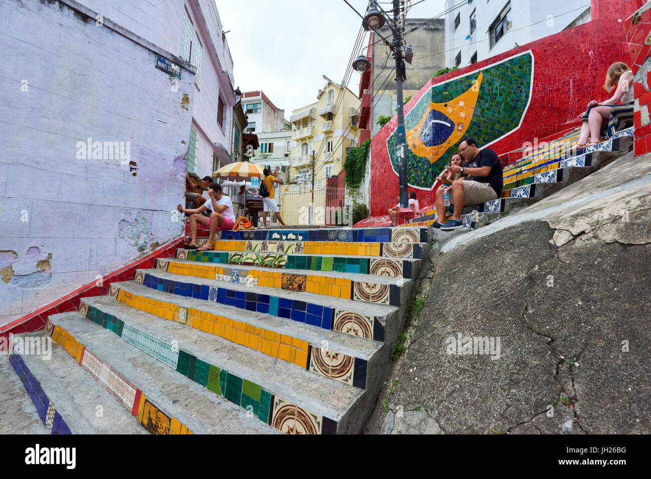 Tourists sitting on Selaron Steps, 215 decorated steps the work of ...
