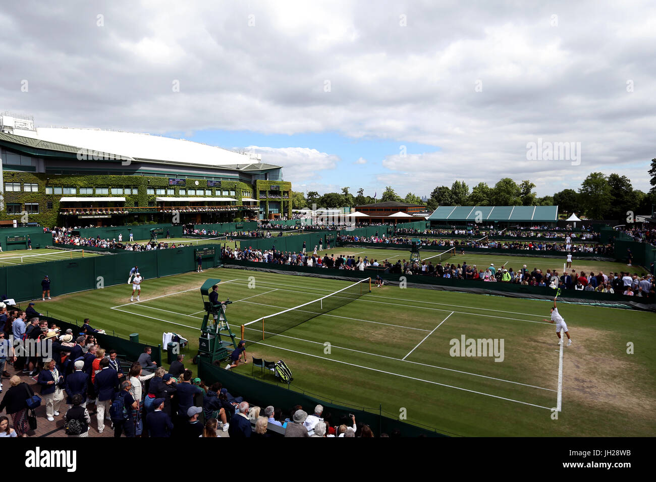 General view across the outside courts with Yuta Shimizu in action on ...