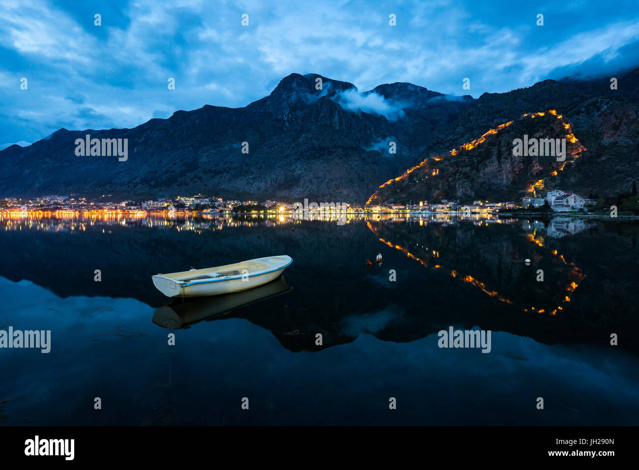 The Old Town (stari grad) and fortress of Kotor reflected in Kotor Bay ...