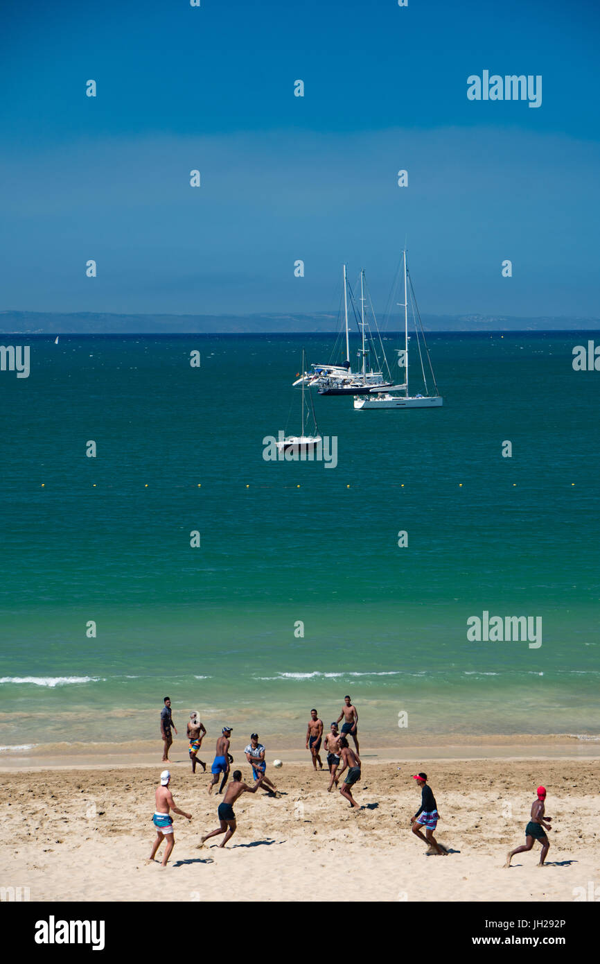 Locals playing rugby on the beach, Mossel Bay, Western Cape, South ...