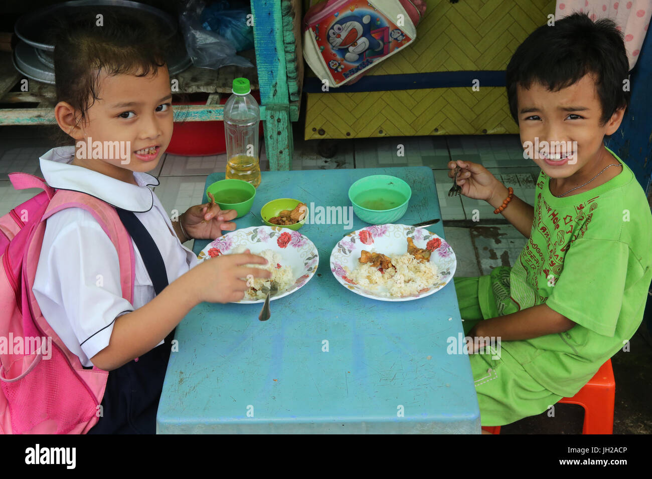 Child eating rice hi-res stock photography and images - Alamy