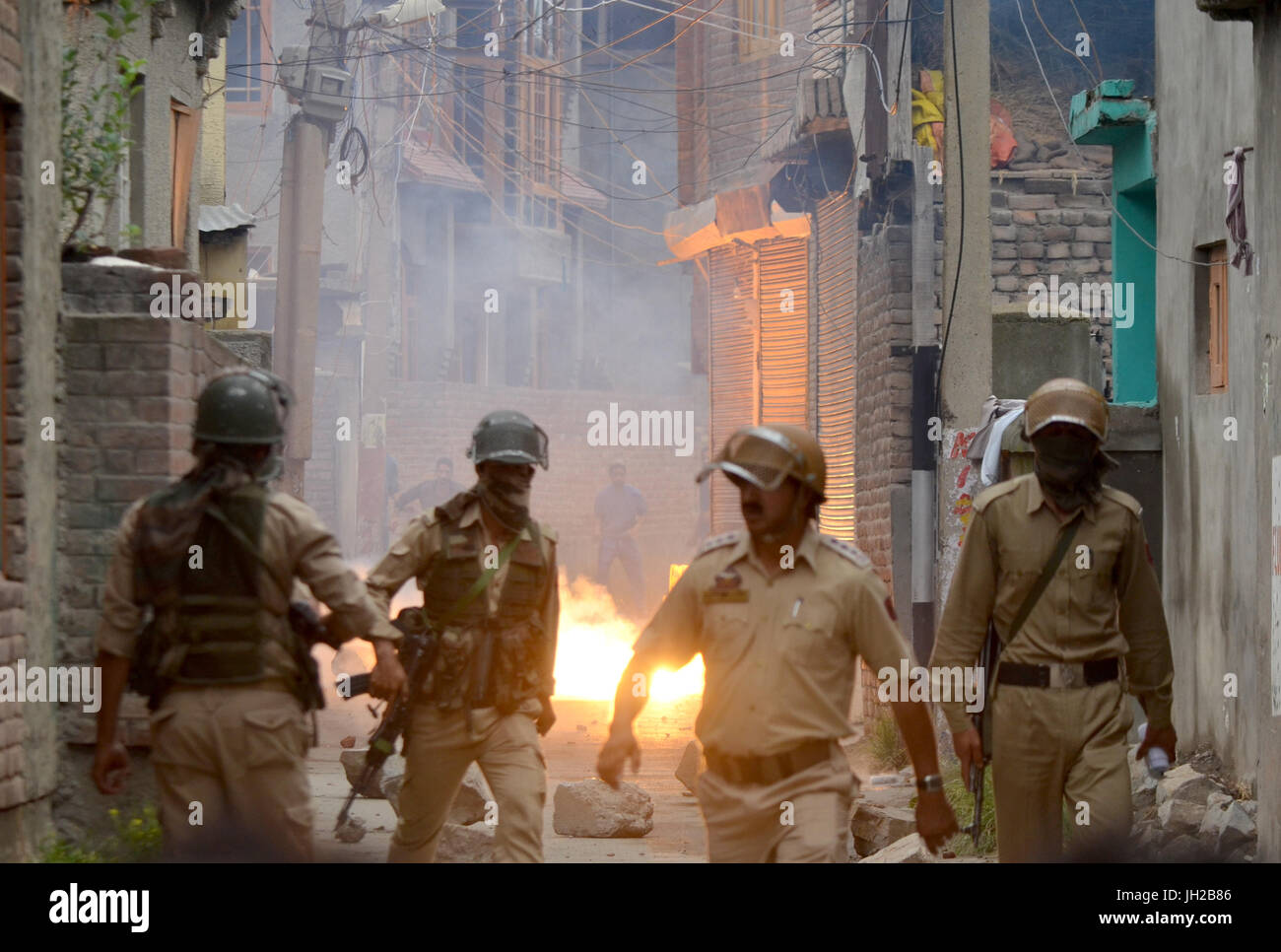 Srinagar, Kashmir. 12th July, 2017. A flash bang shell bursts during ...