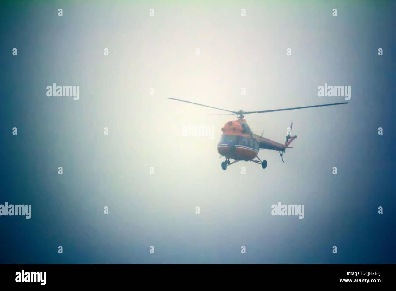 helicopter in fog at sea. air transport in bad weather conditions Stock ...