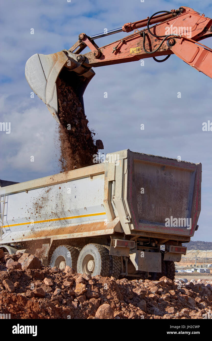 Bulldozer loading sand into the truck Stock Photo - Alamy