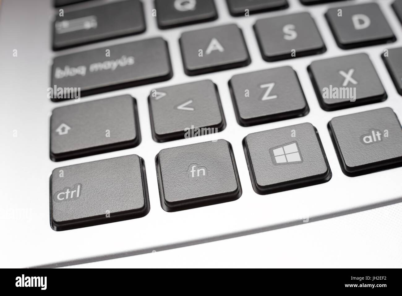 Forefront of a gray laptop keyboard Stock Photo - Alamy