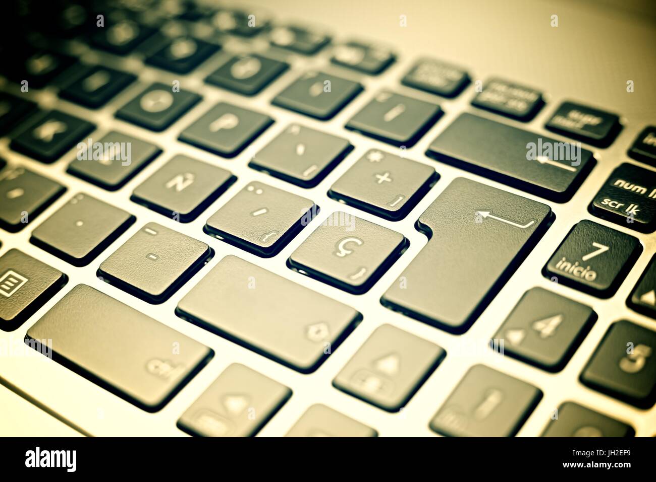 Forefront of a gray laptop keyboard Stock Photo - Alamy