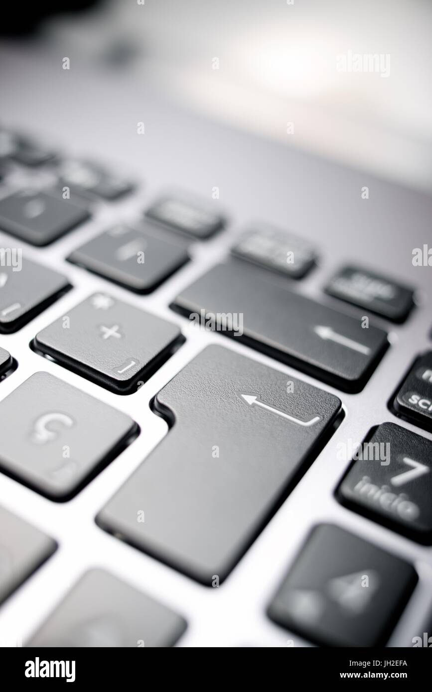 Forefront of a gray laptop keyboard Stock Photo - Alamy