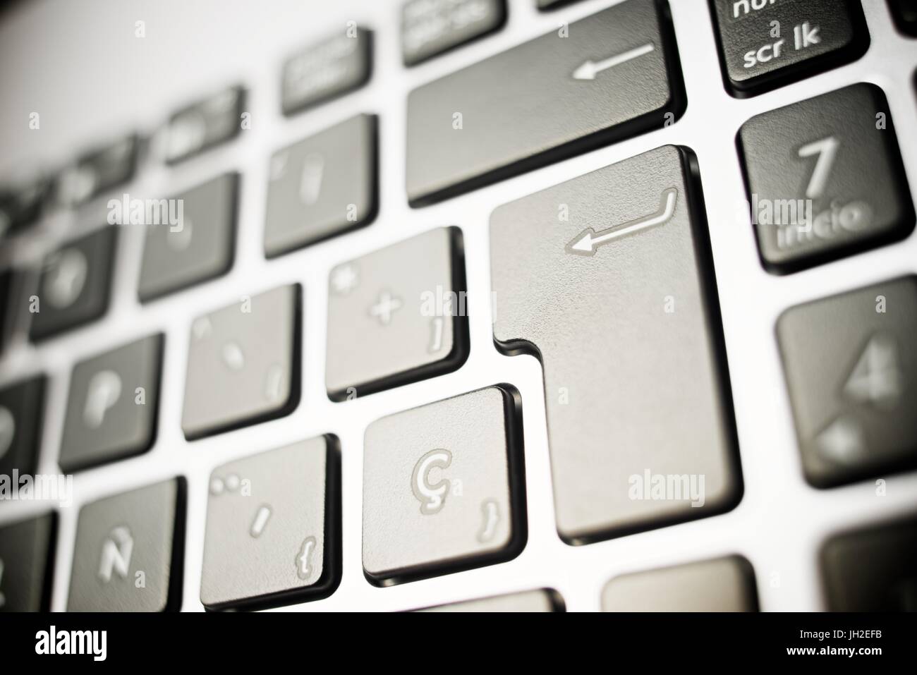 Forefront of a gray laptop keyboard Stock Photo - Alamy