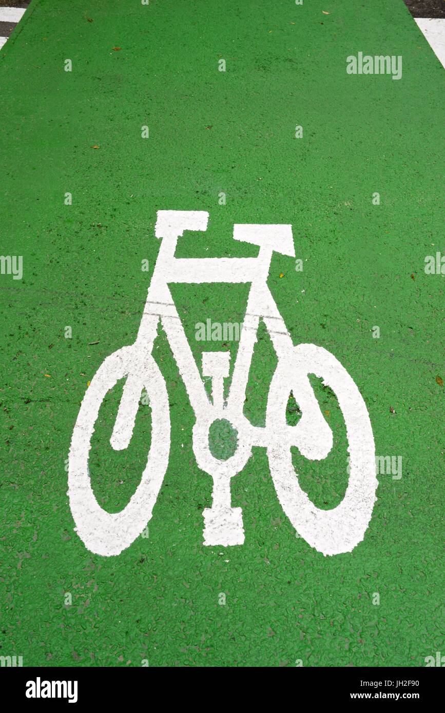 Bike lane sign painted on a street Stock Photo - Alamy