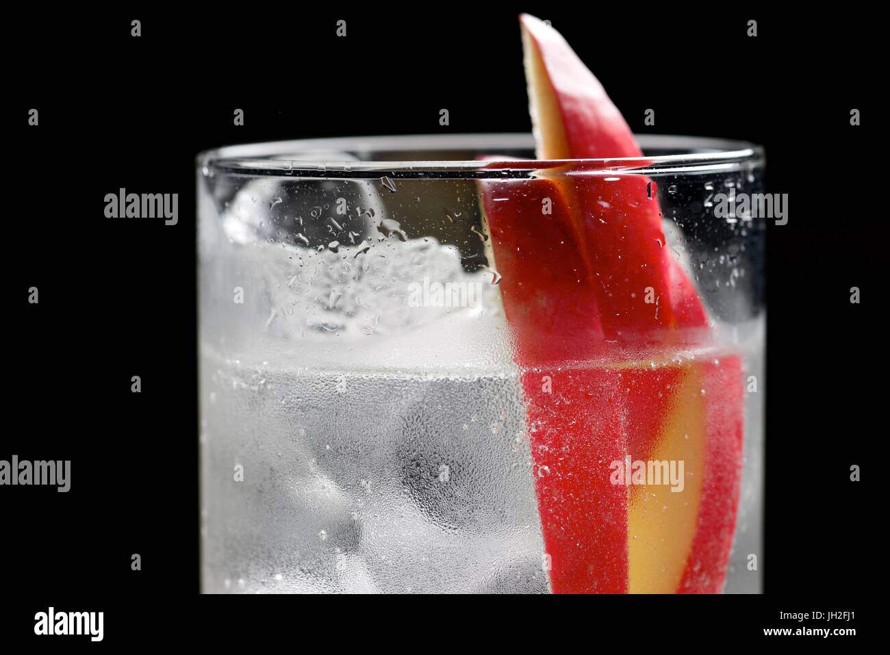Apple gin tonic served in glass Stock Photo - Alamy