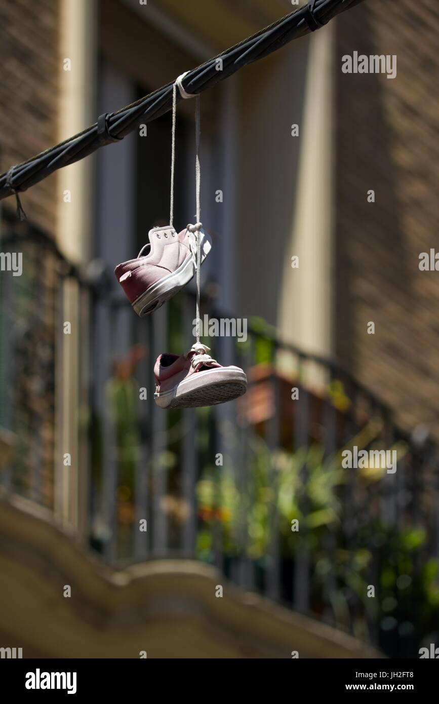 Shoes Hanging From Wire Stock Photos & Shoes Hanging From Wire Stock ...