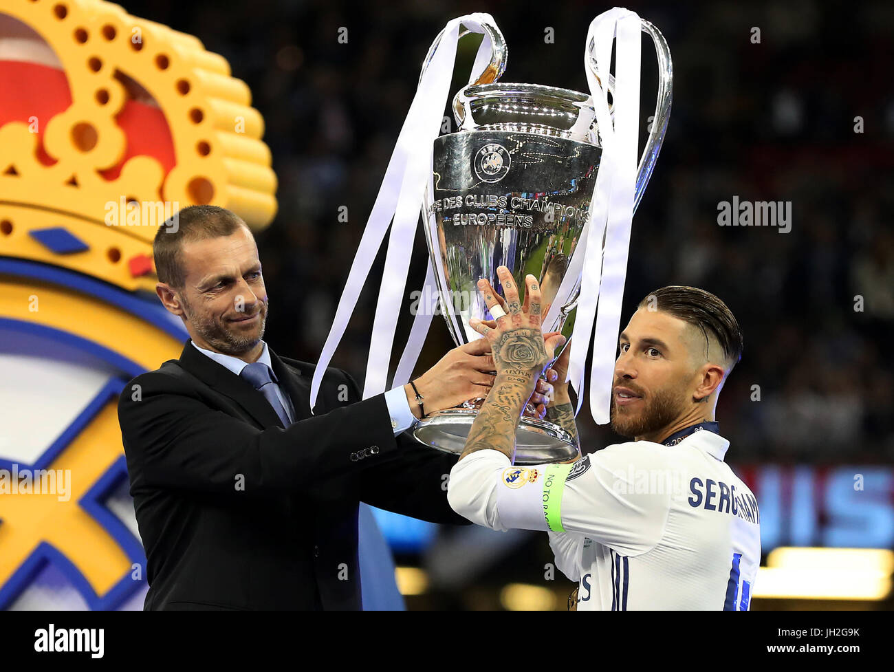 UEFA Aleksander Ceferin hand over trophy to Real Madrid's Sergio Ramo ...