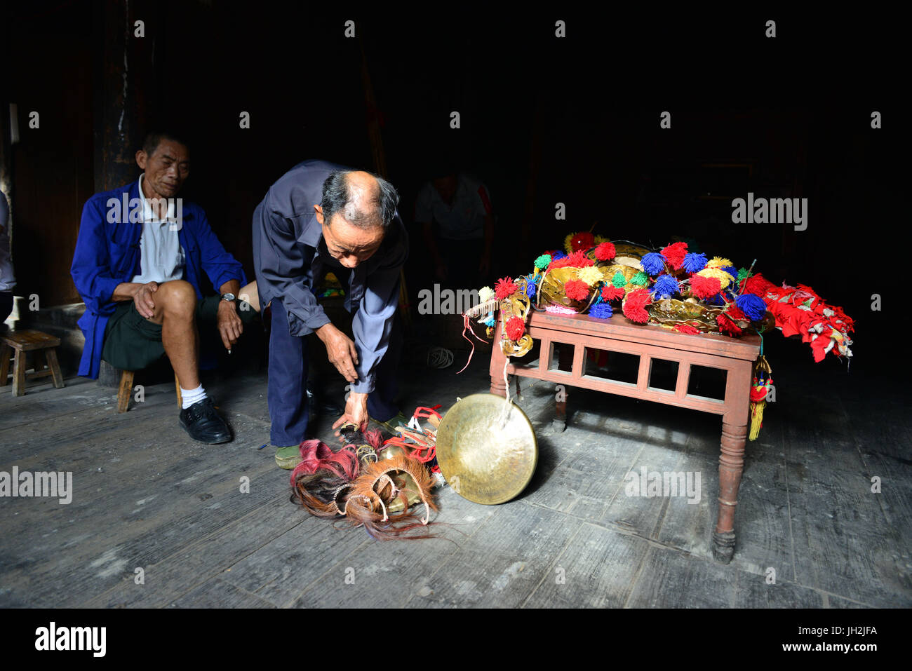 Guizhou, China. 12th Jul, 2017. Wang Helu (R), member of a ...