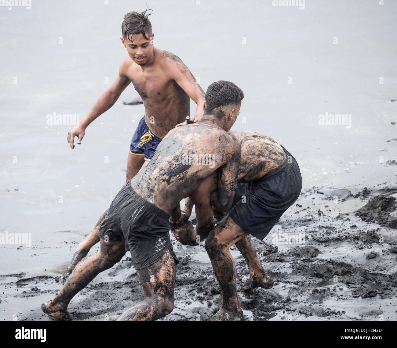 Spanish teenagers fun fighting on beach Stock Photo - Alamy