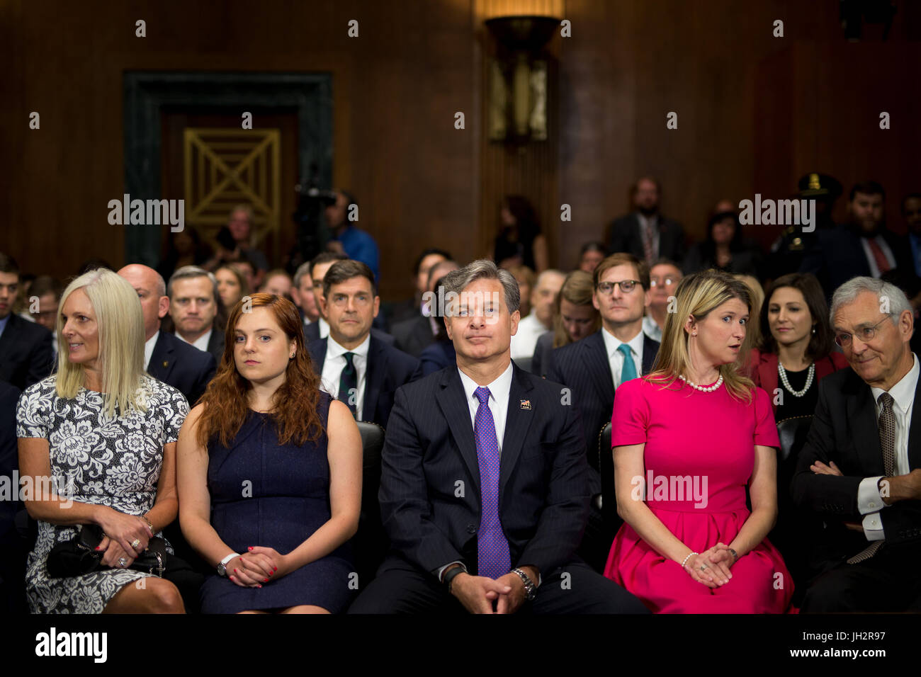 Washington, USA. 12th July, 2017. Christopher A. Wray (C) is seen with ...