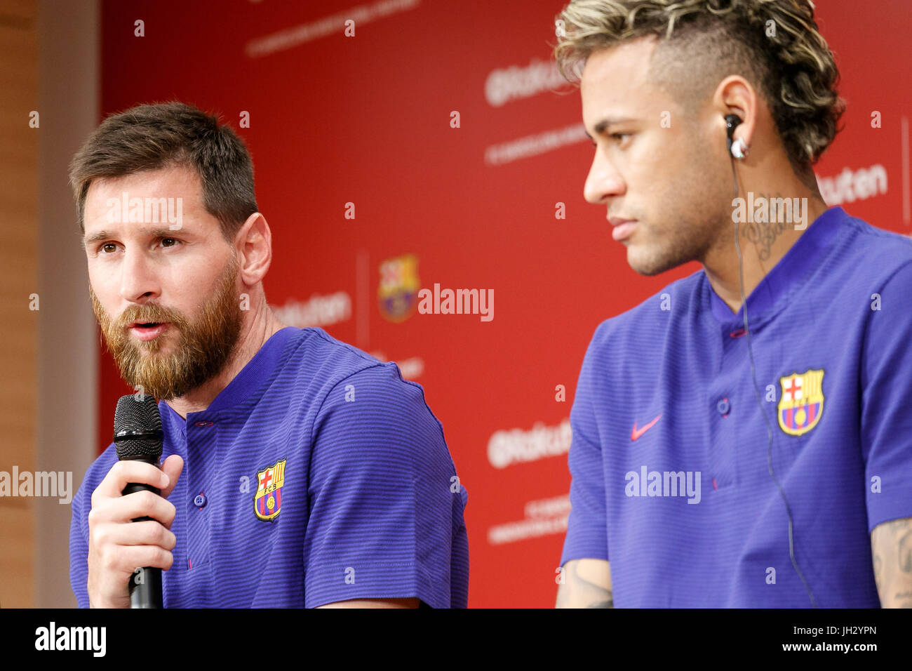(L to R) FC Barcelona players Lionel Messi and Neymar speak during a ...