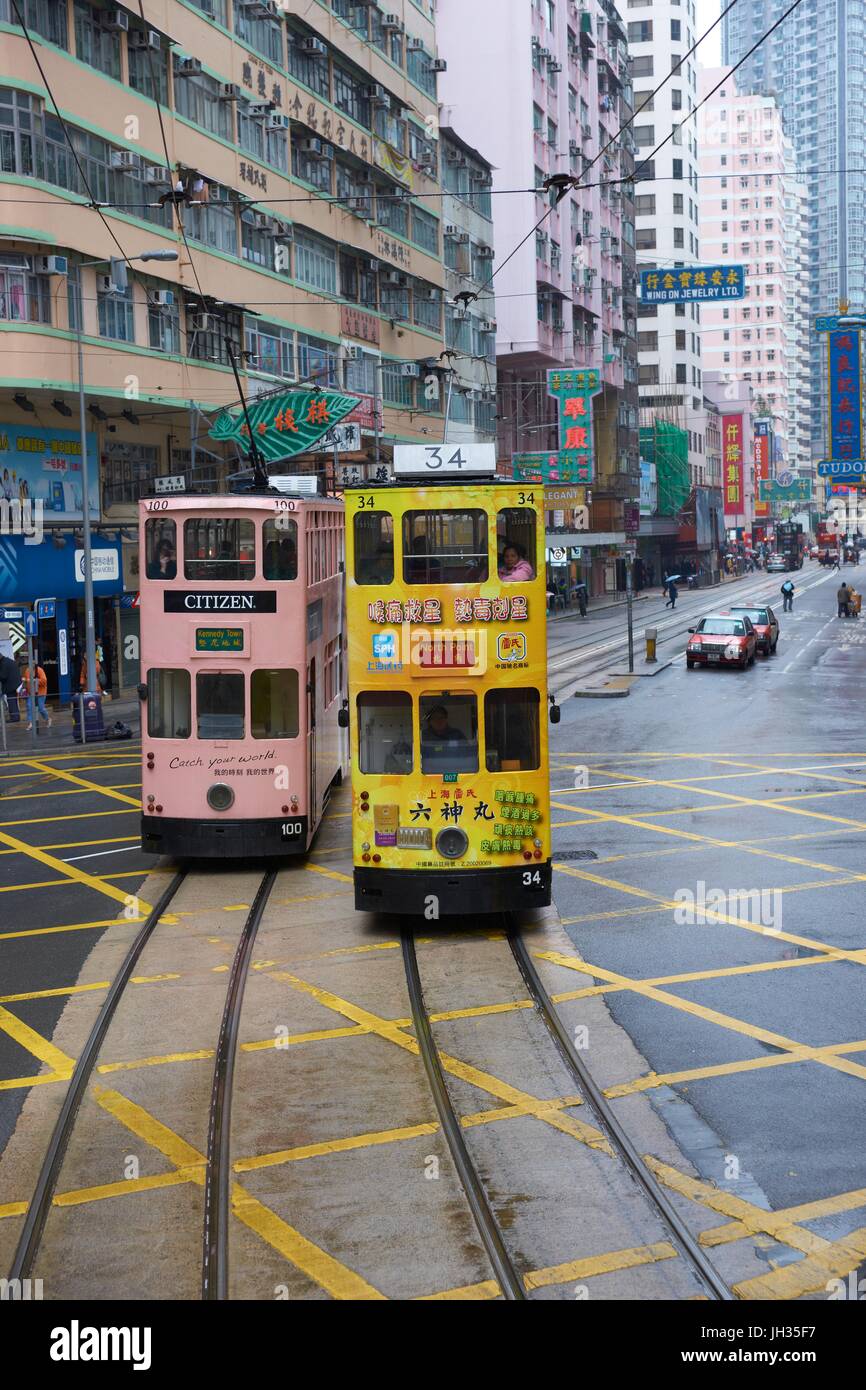 Colorful trams on the streets of Hong Kong Island in Hong Kong, China ...