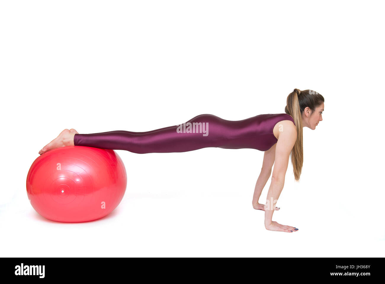 Woman red exercise ball Cut Out Stock Images & Pictures - Alamy
