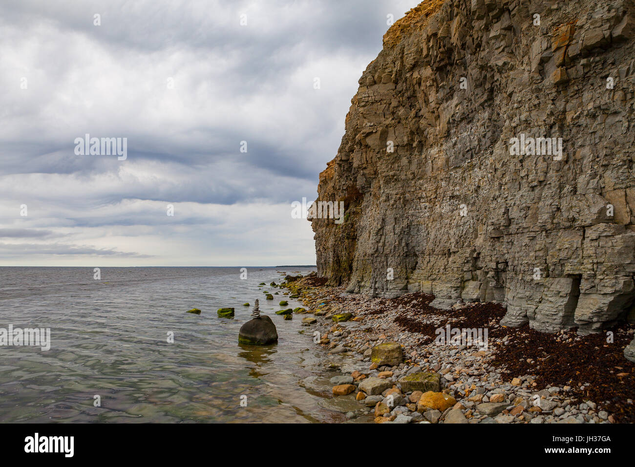 Beautiful rocky sea shore. Baltic limestone cliff Stock Photo - Alamy