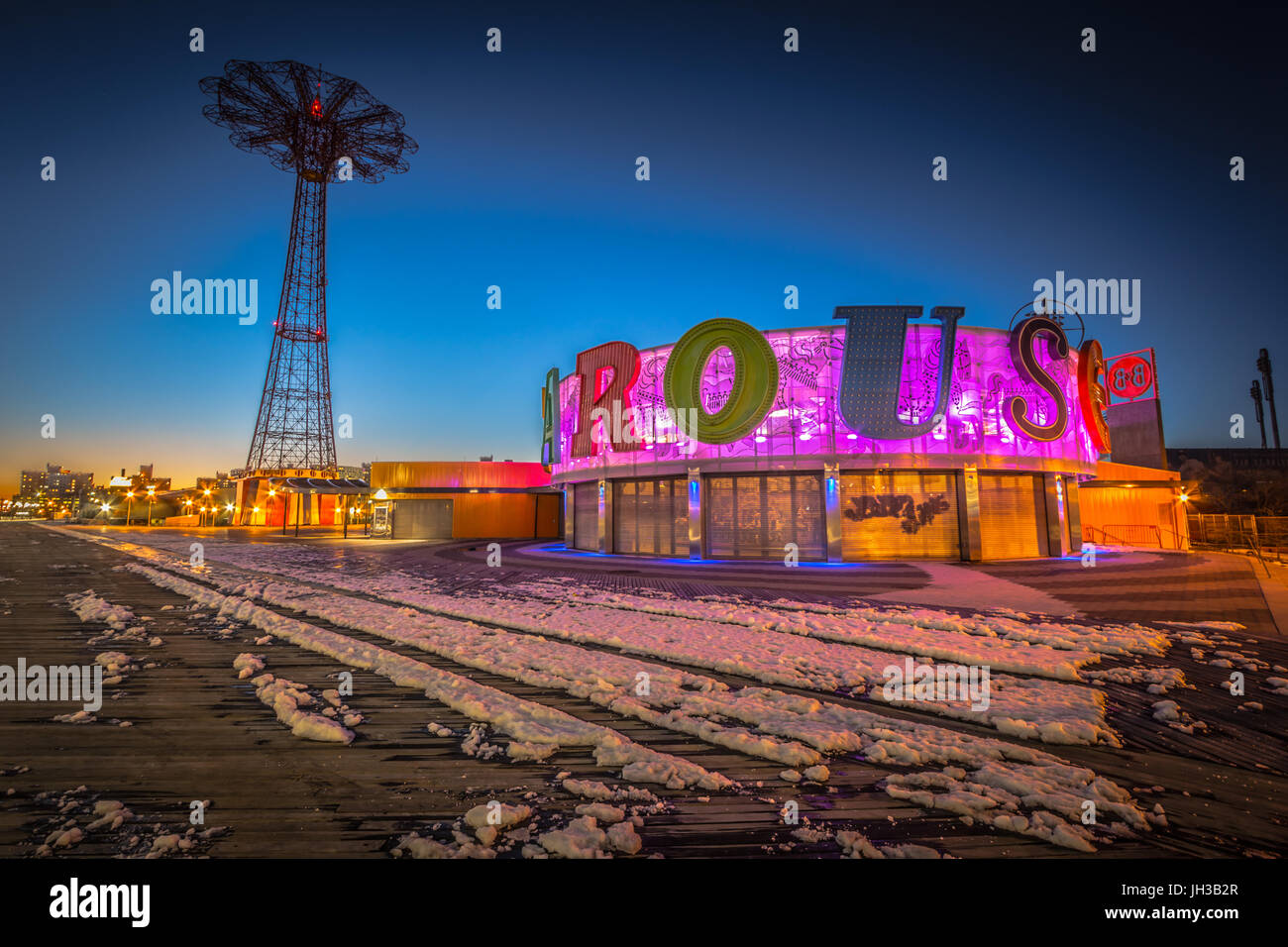 The B&B Carousel illuminated alongside the Coney Island Parachute Jump ...
