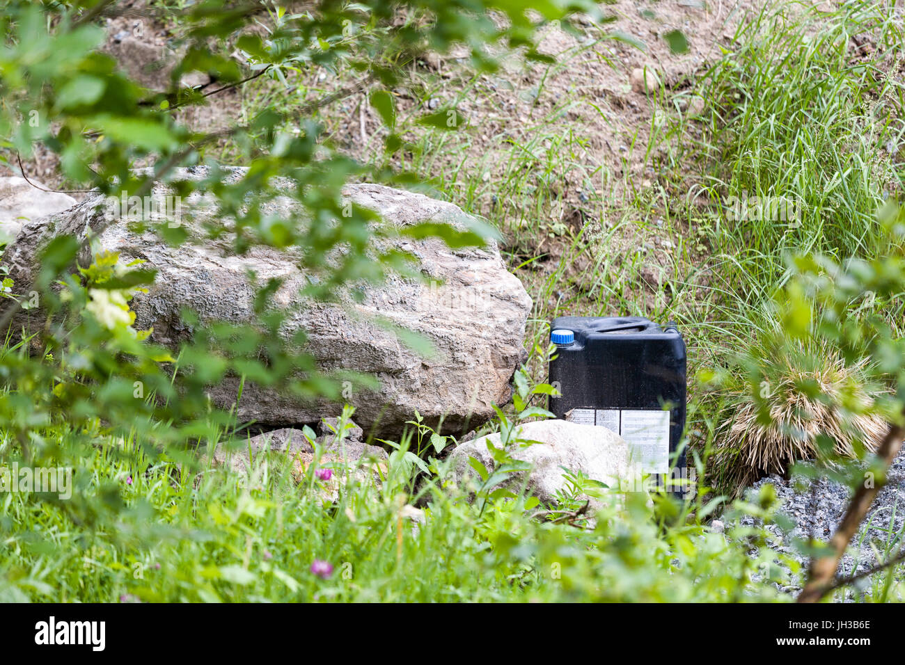 Industrial sized plastic container containing chemical waste litter ...