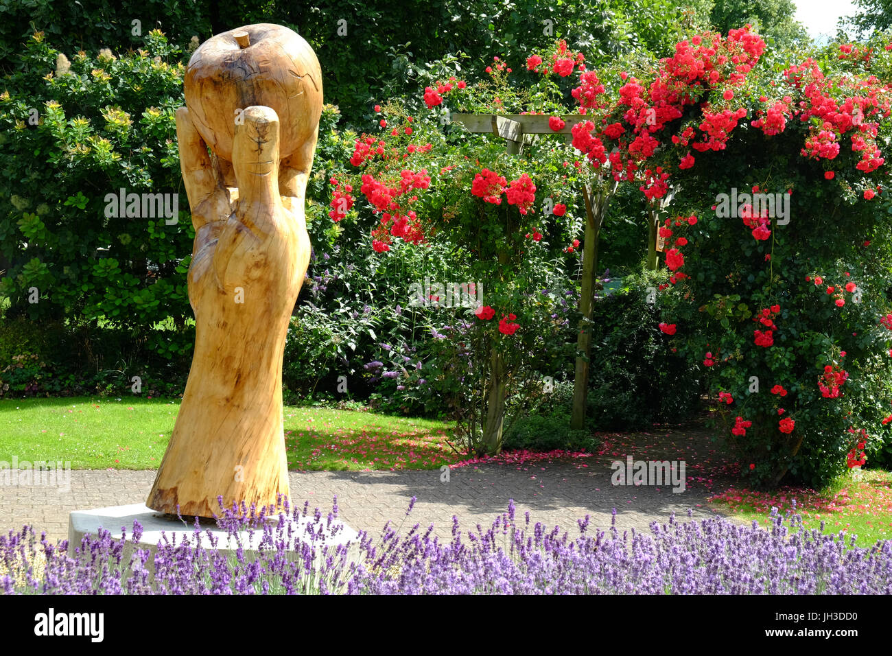 Wooden sculpture of sir Isaac Newton's hand and apple in Wyndham Park ...