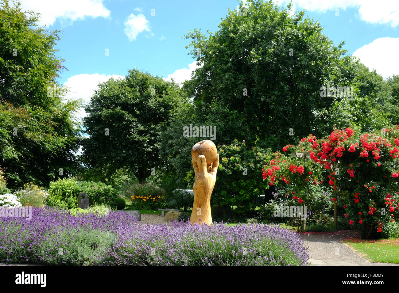 Wooden sculpture of sir Isaac Newton's hand and apple in Wyndham Park ...
